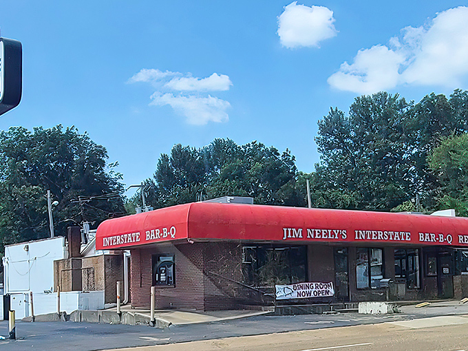 That iconic red awning against the Memphis sky is like a barbecue bat signal, calling hungry souls from miles around.