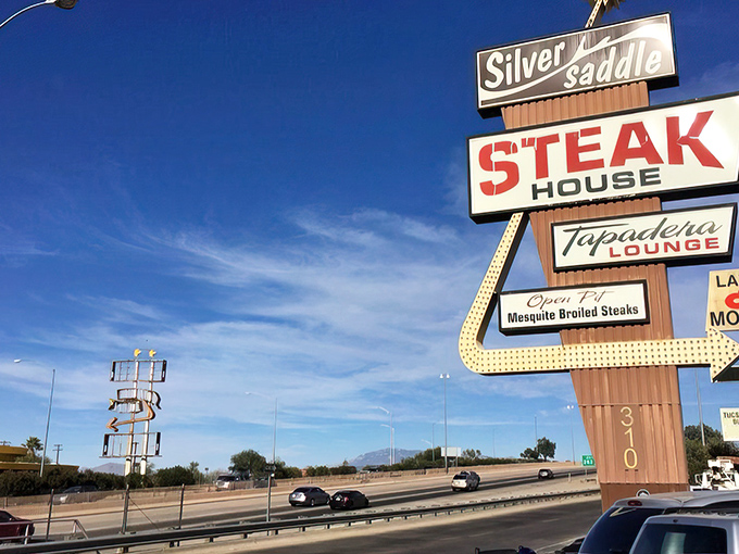 That vintage sign isn't just advertising &ndash; it's a beacon of hope for the hungry. Mesquite-broiled promises under the Arizona sky.