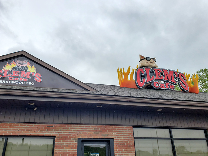 The unmistakable Clem's Cafe sign, complete with sunglasses-wearing pig mascot, promises smoky delights within. Hardwood BBQ never looked so inviting against the Pennsylvania sky.