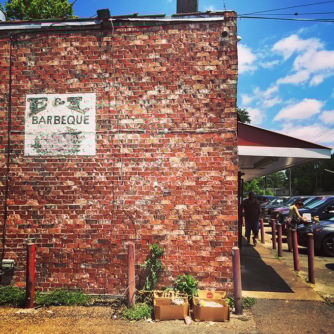 That weathered brick exterior isn't a marketing gimmick&mdash;it's a smoke-stained badge of honor earned through decades of barbecue excellence on Bailey Avenue.