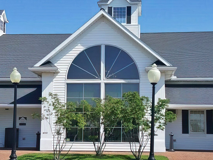 The white farmhouse exterior of Berlin Farmstead stands like a culinary lighthouse in Amish Country, beckoning hungry travelers with promises of comfort food paradise.
