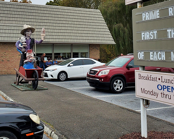The unassuming exterior of Katie's Kitchen, complete with an Amish figure sculpture that seems to say, "Trust me, the food inside is worth the journey."