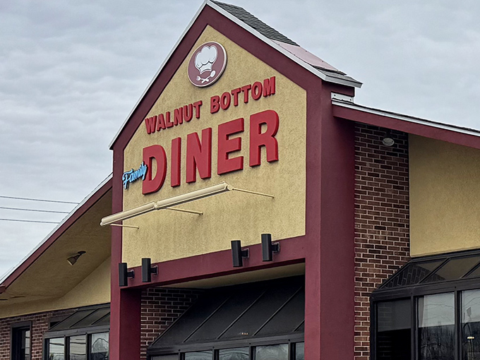 That burgundy sign with the cheerful chef's hat isn't just advertising &ndash; it's practically sending smoke signals to hungry travelers everywhere.