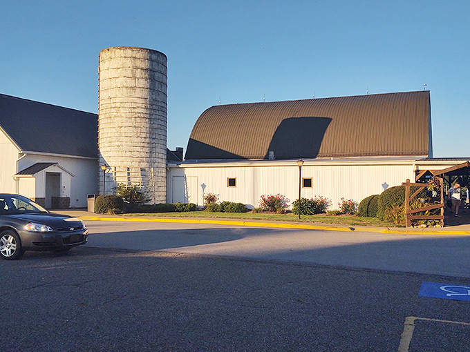 The iconic white barn structure stands proudly against the Ohio sky, complete with its authentic silo&mdash;architecture that doesn't just hint at rural charm, it practically sings it.