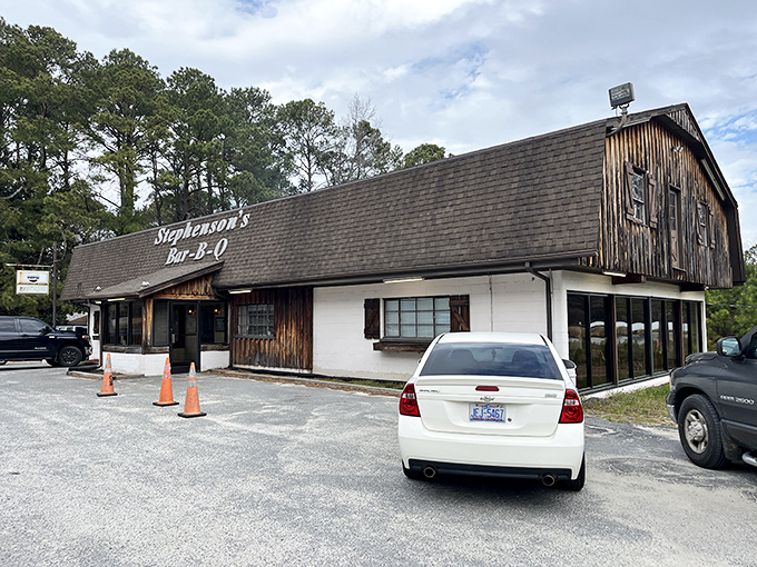 The unassuming exterior of Stephenson's Bar-B-Q stands like a temple of smoke among North Carolina pines, promising delicious revelations within.