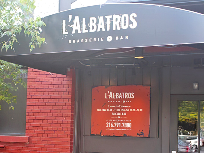 That classic red brick exterior with the elegant black awning says, "Yes, we're fancy, but we still want you to come in your comfortable shoes."