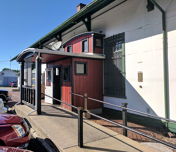 The unassuming red exterior of Depot Pizza tells you everything you need to know&mdash;this place cares more about what's inside than fancy curb appeal. 