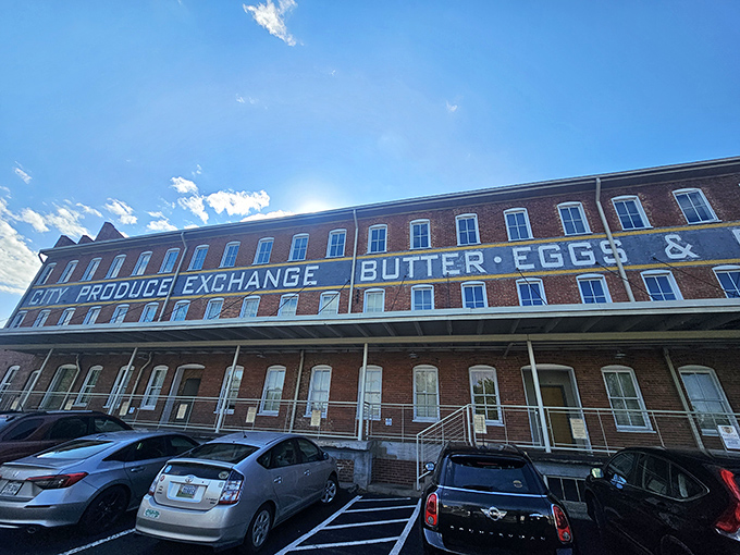 The historic City Produce Exchange building stands proudly against the Virginia sky, its "BUTTER &bull; EGGS" signage a delicious hint of culinary transformations within.