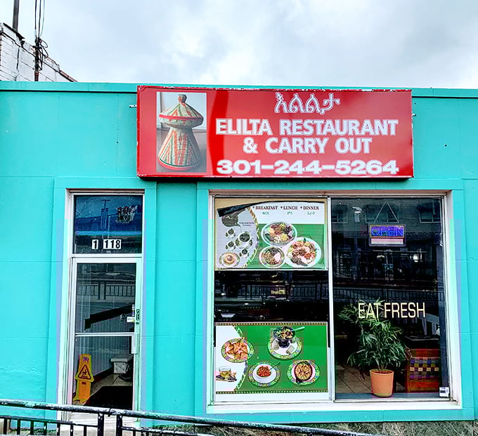 A closer look at Elilta's vibrant exterior reveals colorful food photos that serve as a delicious preview of the authentic Ethiopian journey awaiting inside.