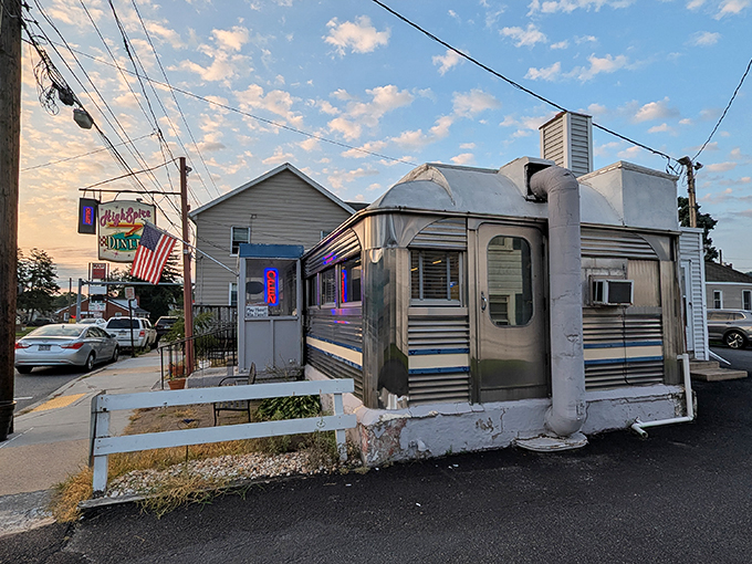 The classic stainless steel exterior gleams in the morning light, a time capsule of Americana waiting to serve up memories alongside breakfast.