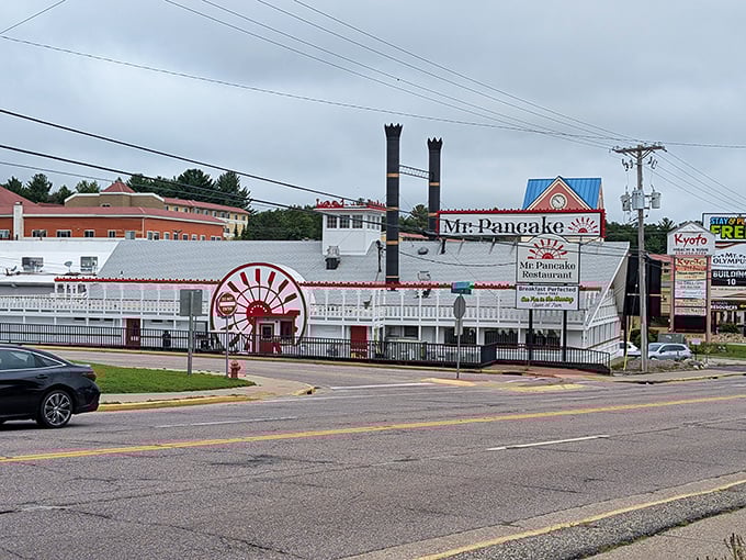 That circular entrance with the bold red awning isn't just a door&mdash;it's a portal to a world where calories fear to tread.