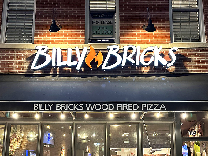Downtown Wheaton's brick facade hides a pizza paradise where locals gather under black awnings for wood-fired bliss.