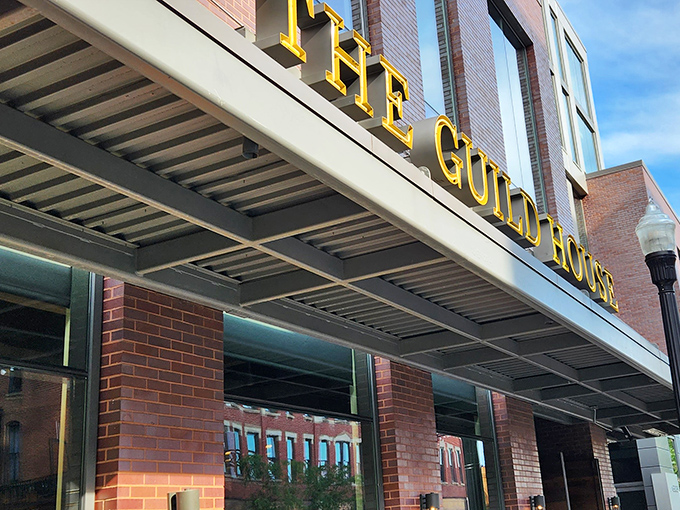 The golden letters of The Guild House shine like a culinary beacon in Columbus's Short North district, promising extraordinary flavors behind that brick fa&ccedil;ade.