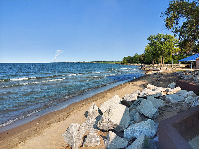 Where Lake Erie meets golden sand, Fairport Harbor Lakefront Park offers a slice of coastal paradise that feels delightfully out of place in Ohio.