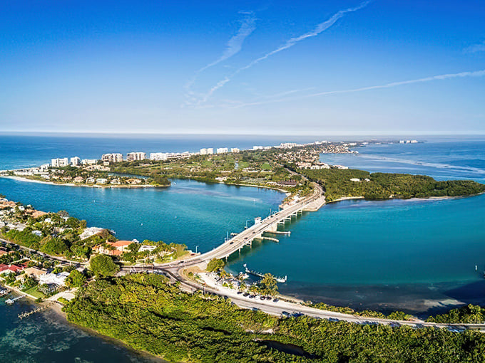 Aerial paradise: Where emerald waters embrace a slender island, creating Florida's version of a watercolor masterpiece come to life.