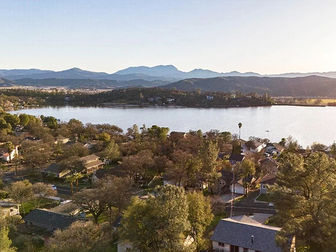 A bird's-eye view that makes you wonder if Bob Ross painted this landscape himself—nature's masterpiece of blue water embraced by California's rolling hills.