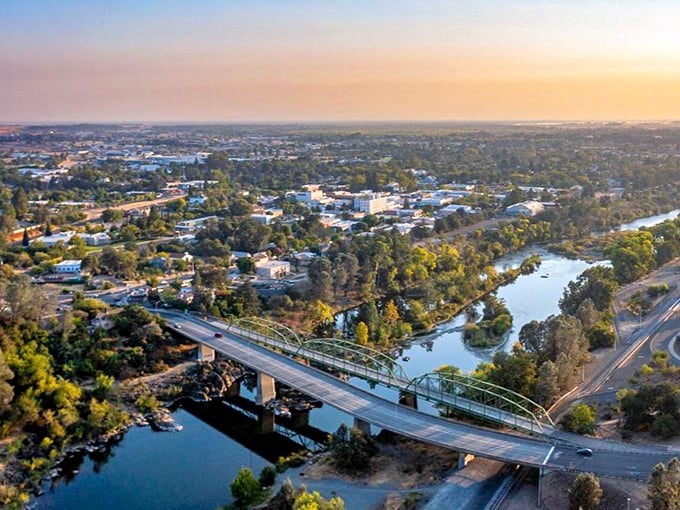 Oroville's golden hour view showcases the perfect marriage of nature and small-town charm. That bridge isn't just connecting banks&mdash;it's connecting generations of California history.