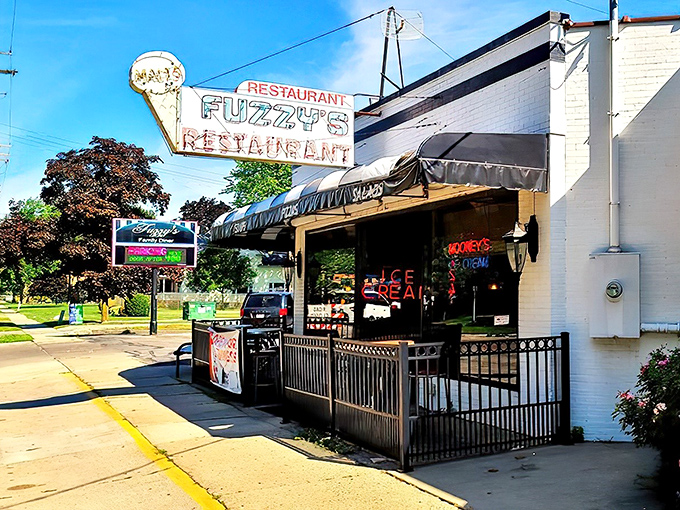 The boat-shaped exterior of Fuzzy's Restaurant stands like a culinary lighthouse in Saginaw, complete with that iconic ice cream cone sign beckoning hungry travelers.
