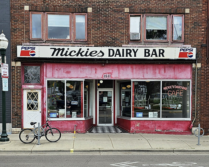 The iconic pink facade of Mickies Dairy Bar stands as a beacon of breakfast hope in Madison, where time seems to have stopped in the best possible way.
