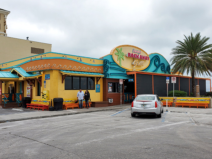 The beachfront beacon of Frenchy's Rockaway Grill welcomes hungry travelers with its vibrant colors and promise of seafood paradise just steps from Clearwater's famous white sands.