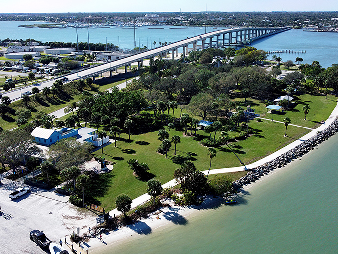 The South Bridge stretches across sparkling waters like a concrete rainbow, connecting Fort Pierce's mainland to barrier island beaches where retirement dreams come true.