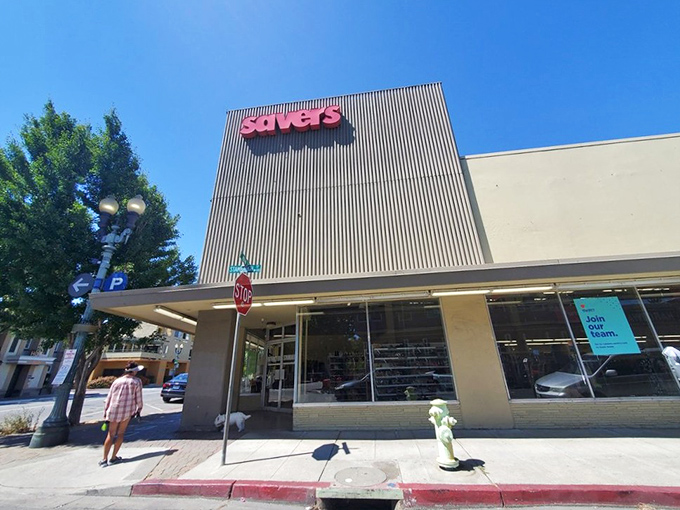 The iconic red Savers sign beckons like a lighthouse for bargain hunters navigating the sea of retail sameness in Redwood City.