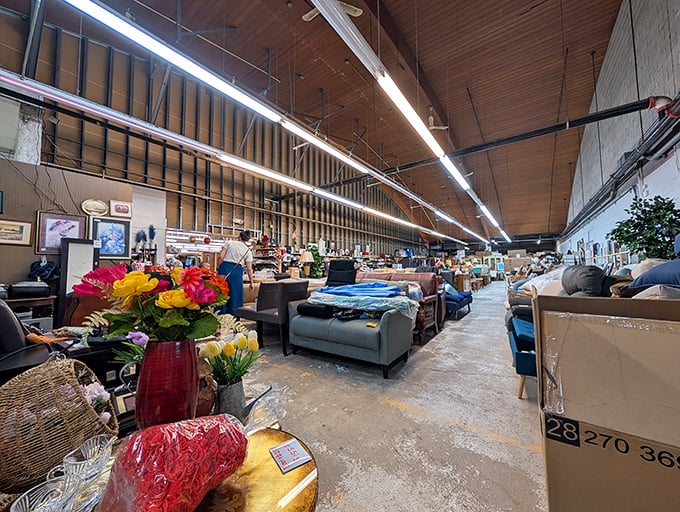 The iconic red and white sign of Trader Buck's beckons bargain hunters like a retail lighthouse, promising treasures within this unassuming Merrillville landmark.
