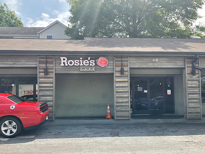 The unassuming exterior of Rosie's Cafe proves once again that culinary treasures often hide behind modest facades. That rose logo promises delicious things await inside.