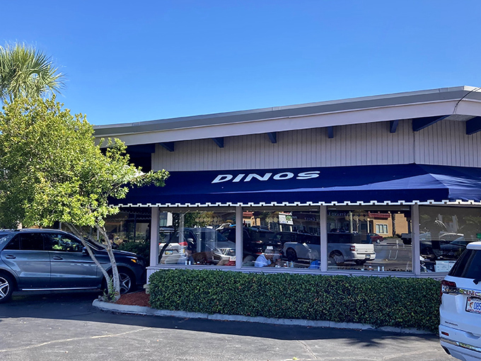 The blue awning of Dino's beckons like a breakfast lighthouse, guiding hungry souls to pancake paradise on North Myrtle Beach's bustling strip.