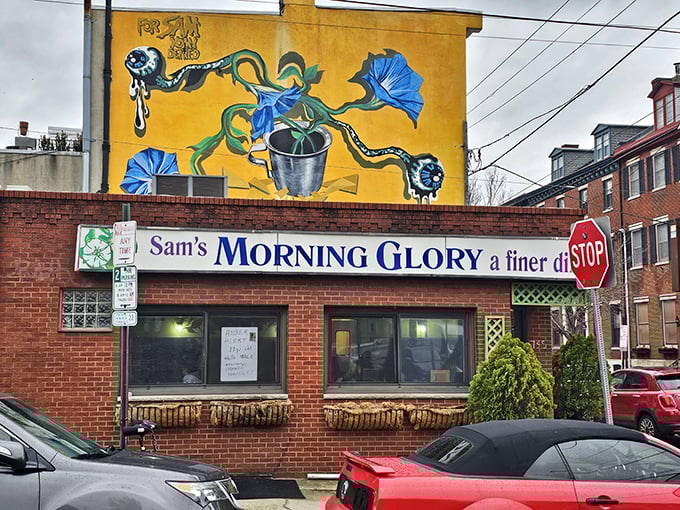 The vibrant yellow mural and brick facade of Sam's Morning Glory Diner stands as a beacon of breakfast hope in Philadelphia's Bella Vista neighborhood.