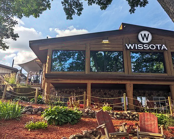 The rustic wooden exterior of Wissota High Shores welcomes boaters and landlubbers alike, promising lakeside dining that's worth the journey.