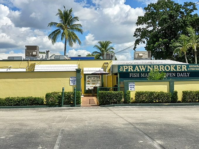 The yellow walls and swaying palms of The Prawnbroker stand like a cheerful beacon for seafood lovers. Florida architecture at its most honest &ndash; unpretentious yet promising. 