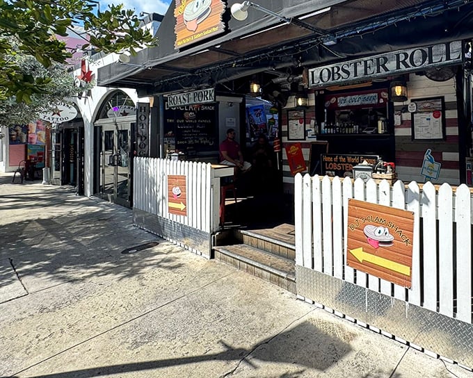 DJ's Clam Shack's charming exterior on Duval Street proves that seafood paradise often comes in small, unassuming packages with white picket fences.