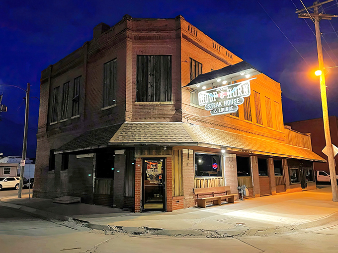 The Hoof & Horn's historic brick building glows like a beacon at twilight, promising carnivorous delights within its walls.