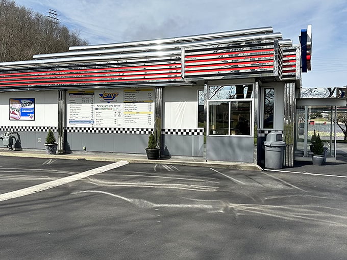 Jerry's Curb Service stands proud like a chrome-wrapped time capsule, ready to serve happiness one milkshake at a time.