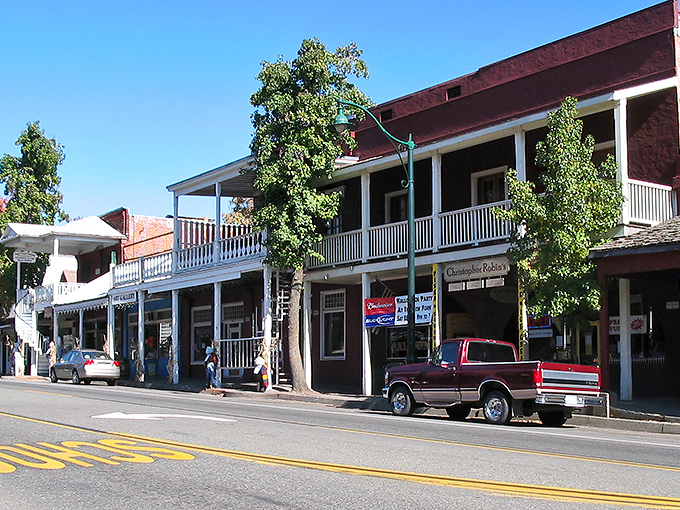 Main Street Weaverville stretches toward the mountains like a postcard from a simpler time, when traffic jams meant three cars at the stop sign.
