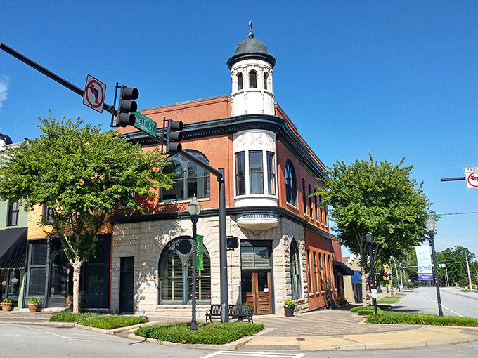 That gorgeous turret makes this corner building look like it escaped from a Victorian novel and decided to stay.