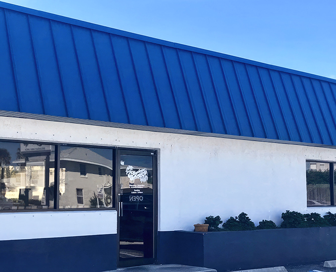 The unassuming blue-roofed exterior of The Blueberry Muffin might not scream "culinary destination," but locals know this Indialantic treasure is where breakfast dreams come true.