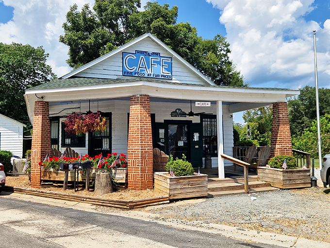 The quintessential Southern storefront that whispers, "Slow down, honey." White clapboard, brick columns, and that iconic blue sign promising good food and fair prices.
