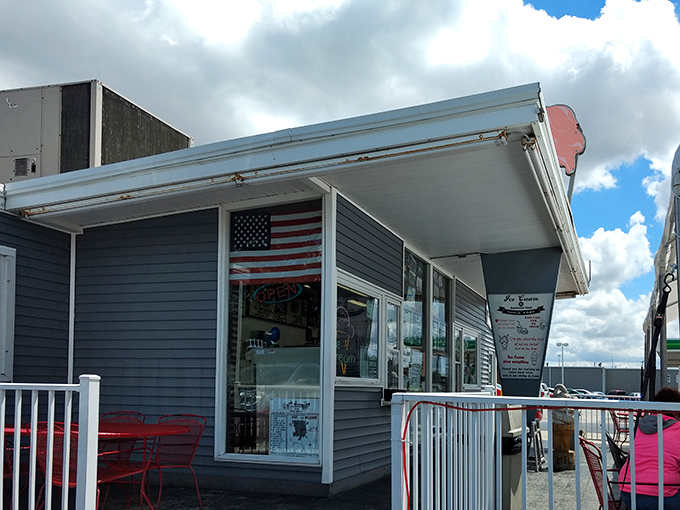 The blue-gray exterior of Miller's Drive-In stands like a humble temple to comfort food, its white fence and awning welcoming hungry pilgrims from across Ohio.
