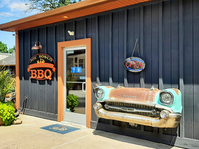 The navy blue exterior with that vintage car front mounted on the wall isn't just decoration&mdash;it's a promise that what awaits inside is classic Americana at its most delicious.