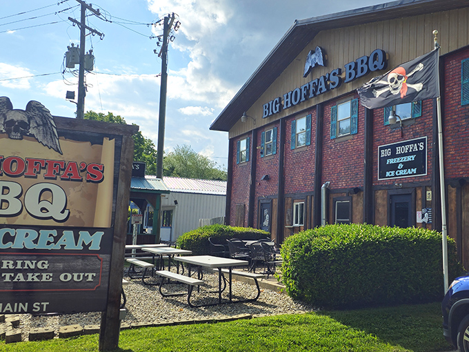 The unassuming brick-and-wood exterior of Big Hoffa's BBQ stands like a barbecue beacon in Westfield, promising smoky treasures within.