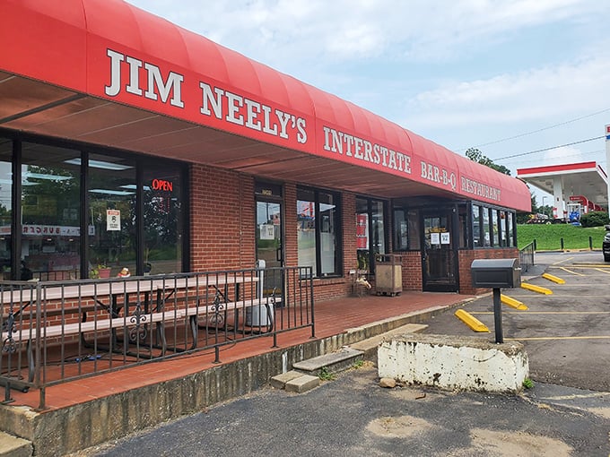 That iconic red awning against the Memphis sky is like a barbecue bat signal, calling hungry souls from miles around.