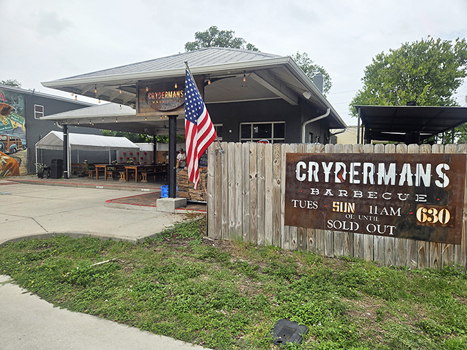 The American flag waves proudly outside Crydermans, where patriotism and pit-smoked perfection go hand in hand. A wooden sign warns: "Until Sold Out" &ndash; words to live (and arrive early) by.
