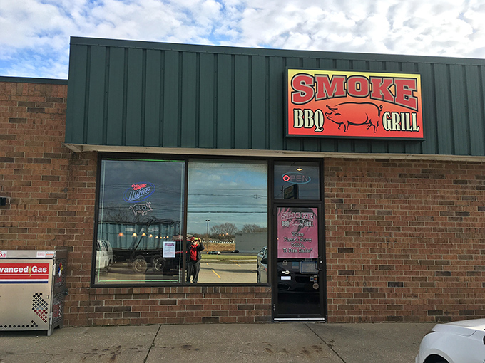 The unassuming brick exterior of Smoke BBQ hides culinary treasures within. Like finding a diamond in a strip mall, this place proves greatness needs no fancy facade.