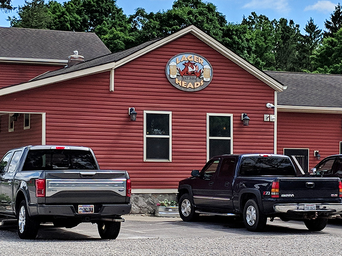The rustic red exterior of Lager Heads stands like a beacon for BBQ pilgrims. This unassuming building houses smoky treasures worth crossing county lines for.
