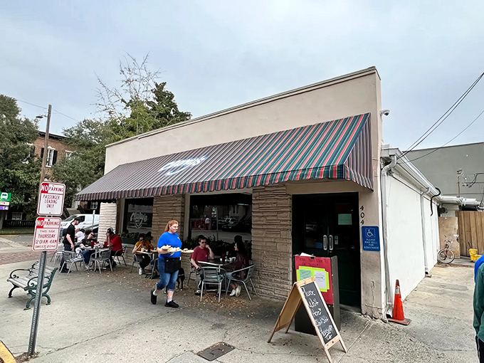 The colorful striped awning of Clary's beckons like an old friend, promising comfort food and conversations that flow as freely as the coffee.