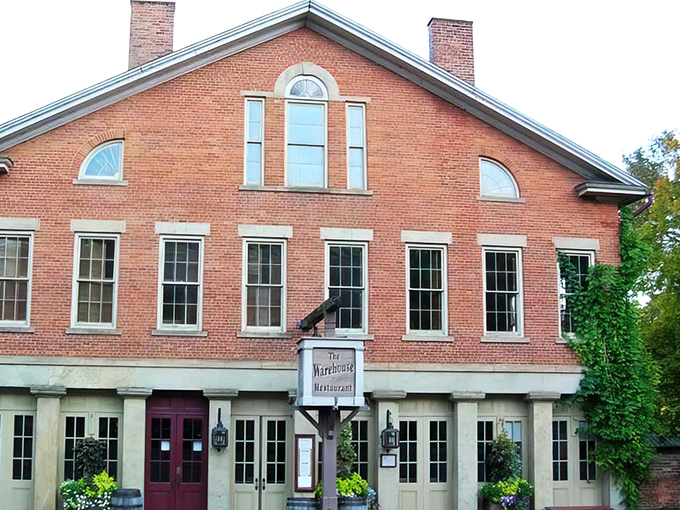 The historic brick fa&ccedil;ade of The Warehouse Restaurant stands proudly in Coshocton, its burgundy doors promising culinary adventures within those sturdy walls.