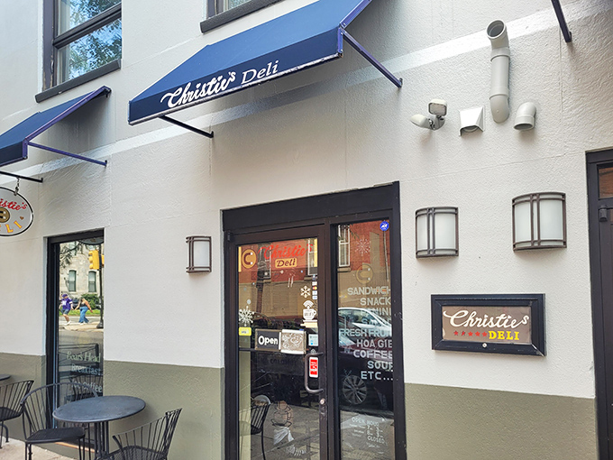 The blue awning of Christie's Deli stands out like a superhero cape for sandwich lovers, promising delicious rescue from hunger pangs.