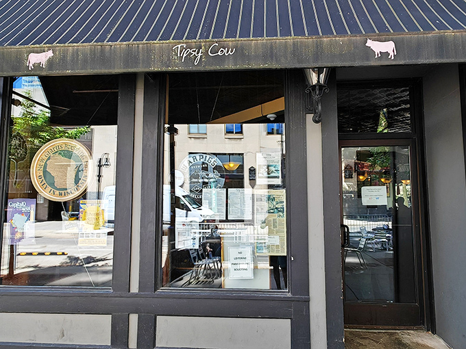 The unassuming storefront of Tipsy Cow beckons with its simple charm. Those cow silhouettes aren't just cute decoration&mdash;they're a promise of dairy-forward delights inside.